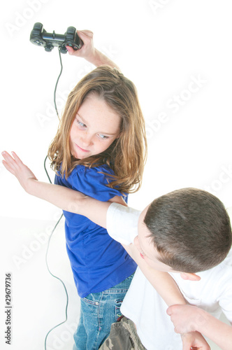 "kids fighting over video controller" Stock photo and royalty-free ...