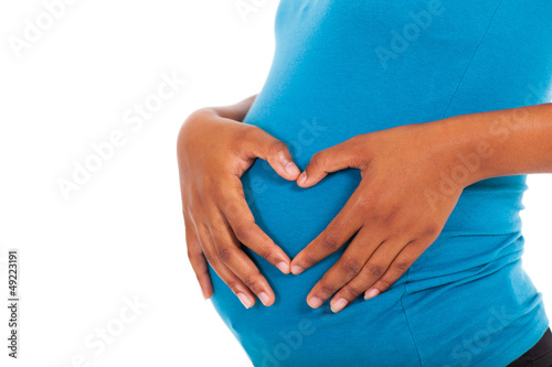 Pregnant African American Woman Hands On Belly の ストック写真と