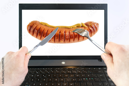 "Man is eating virtual food from laptop screen" Stockfotos und ...