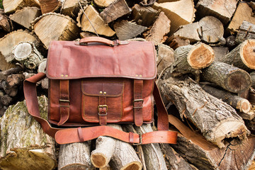 Vintage Leather Messenger Bag Outdoors on Stone Bench from Pikwizard