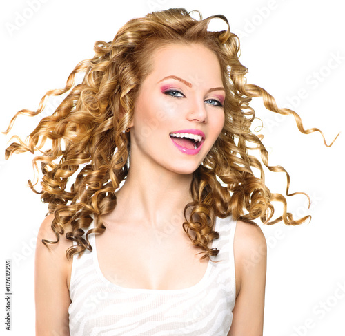 "Beauty model girl with blowing blonde curly hair" Stock photo and ...