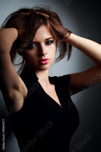 Beautiful Sexy Makeup Young Woman Holding Hair The Hand And Look