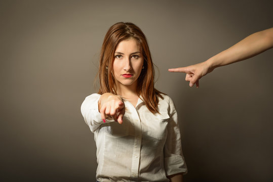 Person Pointing At Someone Else