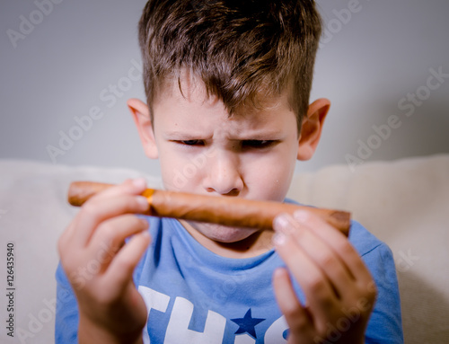 "Child looks suspiciously a cigar" Stock photo and royalty-free images ...