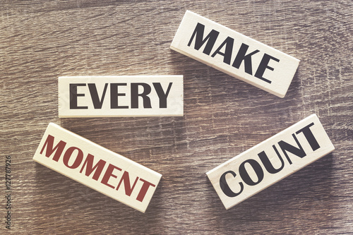 "Make every moment count. Motivational quote written on wooden tiles ...