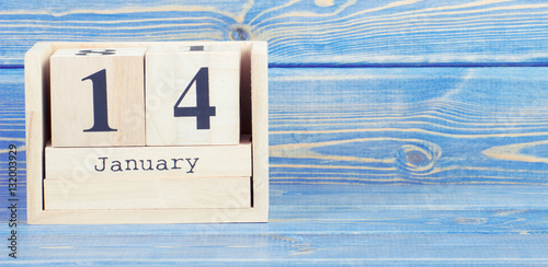 "Vintage photo, January 14th. Date of 14 January on wooden cube ...