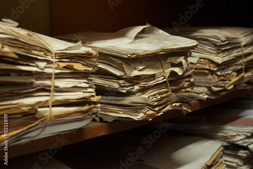 "Dusty old stack of papers and files in archive room of office" Stock ...