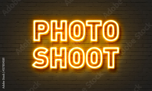 "Photo shoot neon sign on brick wall background." Stock photo and ...