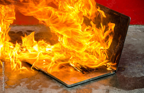 "Laptop computer on fire and burning furiously" Stock photo and royalty ...