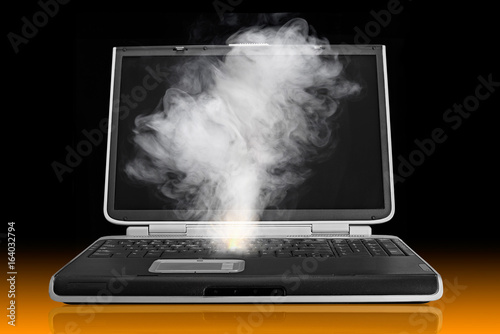 "Laptop computer overheated and caught fire, emmiting cloud of smoke ...