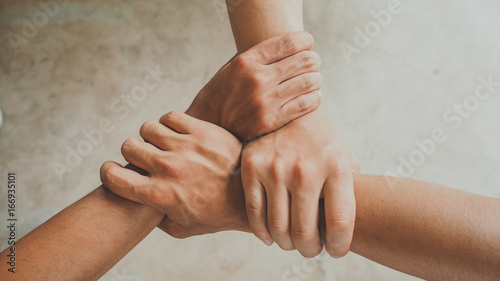 "Three human join hands together, collaboration concept of business and ...