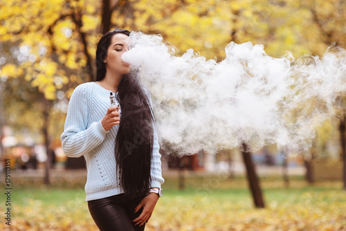 Vaping Young Beautiful Woman Vaping With Smoke Outdoors Vapor