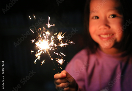 "Children enjoy with firecrackers at outdoor." Stock photo and royalty ...
