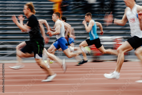"final running men sprinters runners in 100 meters blurred motion ...
