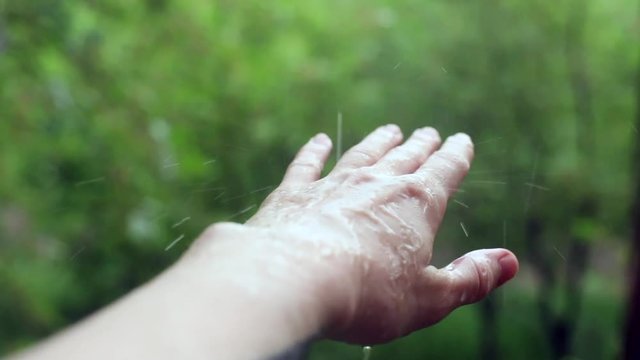 Raindrops Falling On Hands