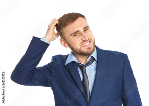 "Young man scratching head on white background. Annoying itch" Stock ...