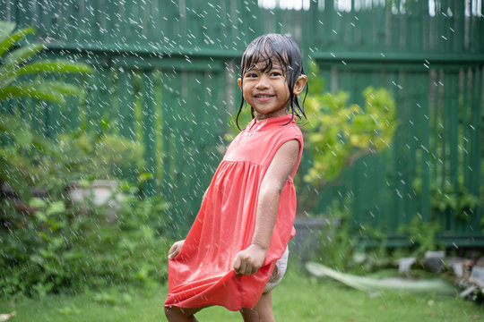 Children Dancing In The Rain Background