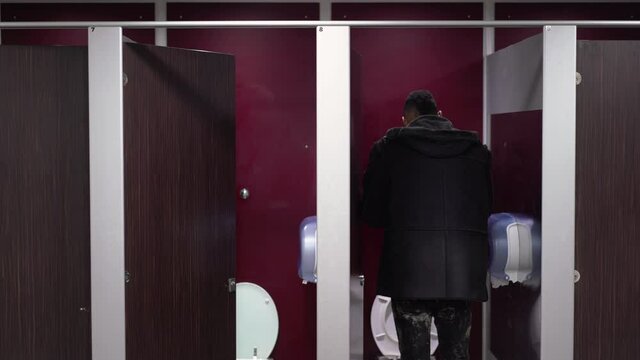 Men In Bathroom Stall