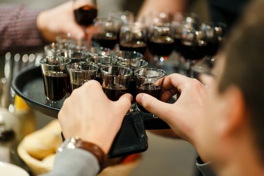 People Taking Shots Of Alcohol