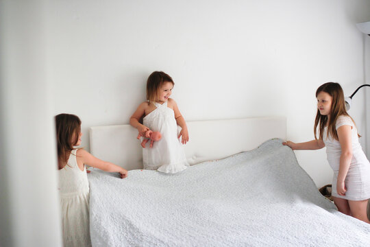 Kids Making Bed