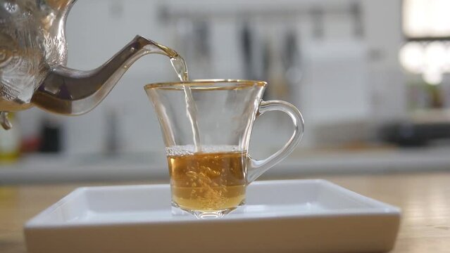 Overflowing Cup Of Tea