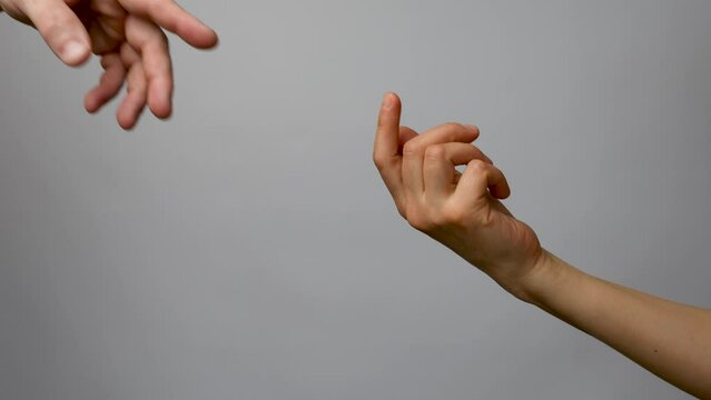 Two Hands Reaching For Each Other