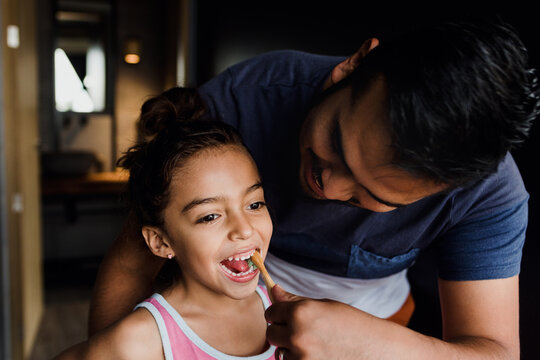 Hispanic Boy Brushing Teeth