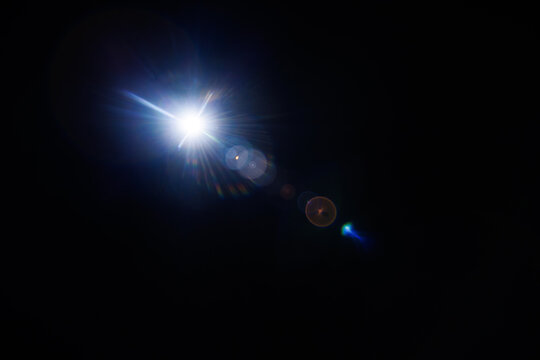 Dynamic Lens Flare with Light Beams on Dark Background - Free Stock ...