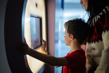 Children exploring interactive exhibit at science museum
