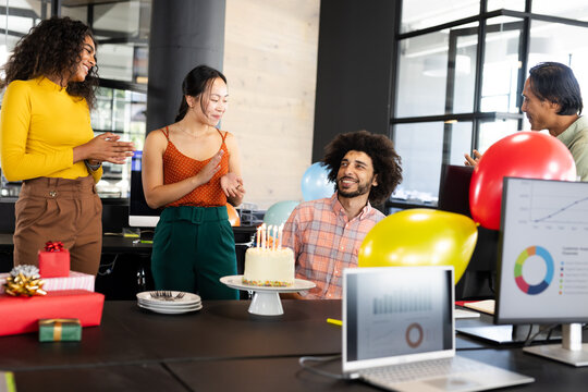 colleagues celebrating birthday in modern office setting - Free Stock ...